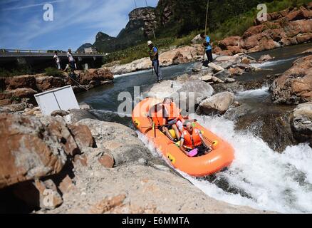 Xinglong, China's Hebei Province. 27th Aug, 2014. Tourists drift down a ...