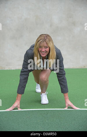 Businesswoman starting race ready set go position Stock Photo - Alamy