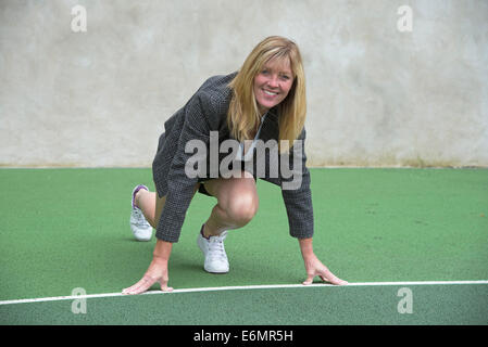 Businesswoman starting race ready set go position Stock Photo - Alamy
