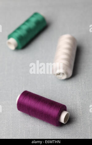 Heap of purple sewing threads, closeup Stock Photo - Alamy
