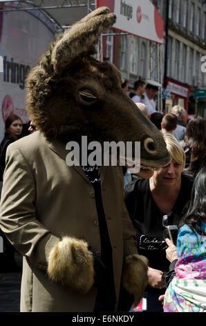 Man wearing a donkey's head (Bottom) promoting a show at the annual ...
