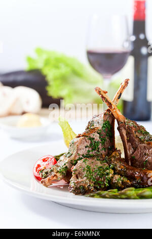 Stewed mutton with grilled vegetables on a white plate Stock Photo - Alamy