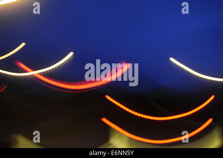 different coloured curved light trails Stock Photo - Alamy