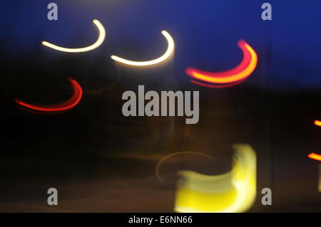 different coloured curved light trails Stock Photo - Alamy
