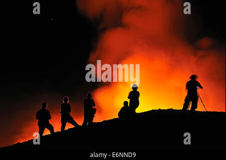 People watching lava flowing to the sea from Kilauea Volcano, Big ...