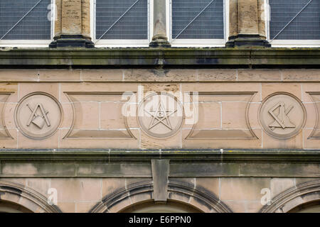 Masonic symbols on a stone mason lodge/house in Spain Stock Photo - Alamy