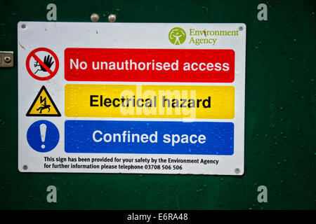 Environment Agency hazard warning sign on seawall at Reculver Herne Bay ...