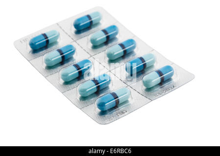 close up of a blister pack containing red and white capsules of a ...