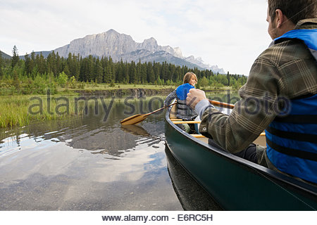 Child rowing a paddle boat View from the side. Close up Stock Photo - Alamy