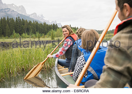 Child rowing a paddle boat View from the side. Close up Stock Photo - Alamy