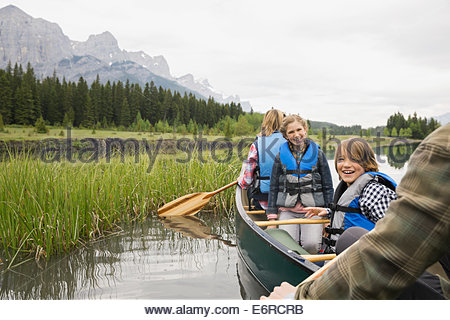 Child rowing a paddle boat View from the side. Close up Stock Photo - Alamy