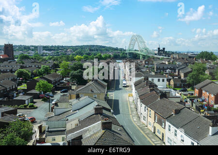 view from runcorn widnes bridge through arch of railway bridge to ...
