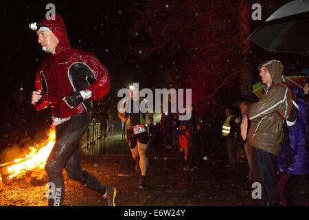 Chamonix, France. 29th Aug, 2014. A runner moves through the Notre Dame ...