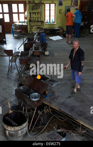 Glassmakers, Glassblowers forming molten glass, glass factory, Ajeto ...