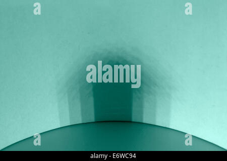 Multiple shadow of Miniature Home on wall Stock Photo - Alamy