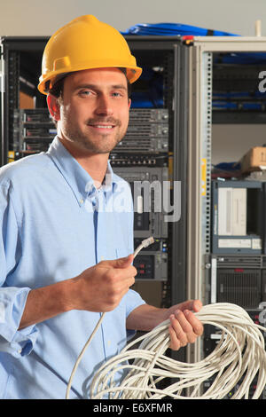 Network engineer preparing structured cabling for data center Stock ...