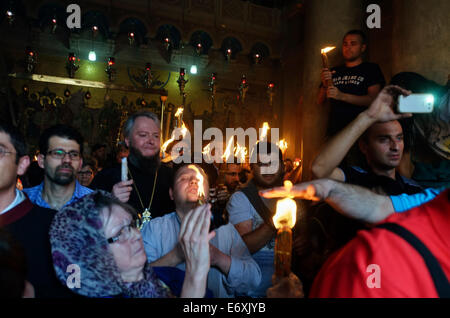 People celebrating Great Saturday inside the Church of the Holy ...