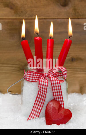 Candles with a red bow Stock Photo - Alamy