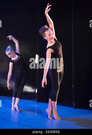 two 2 Teenage girls dancing on stage in a dance school showcase Stock ...
