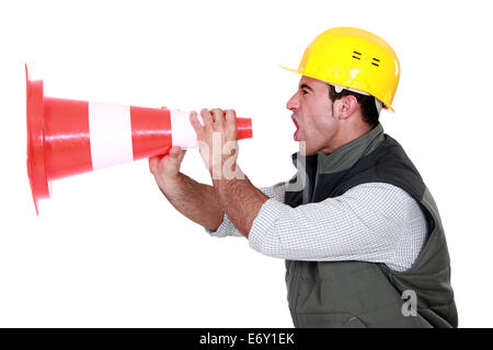 Mason shouting through traffic cone Stock Photo - Alamy