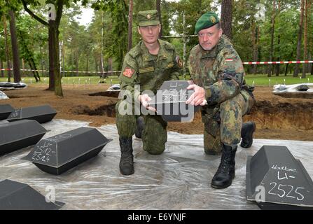 The reburial of German soldiers remains at a German memorial cemetery ...