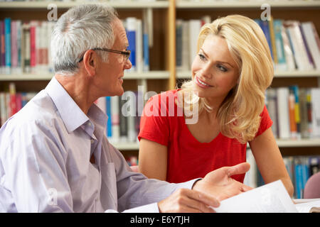 Portrait of students sitting in the library Stock Photo - Alamy