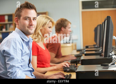 Students researching at computers in library Stock Photo - Alamy
