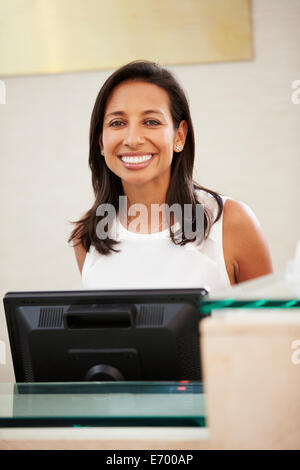 Female hotel receptionist in uniform on white background Stock Photo ...