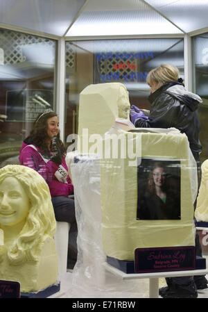 A butter sculptor at the Minnesota State Fair creating a sculpture of a ...