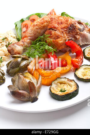 Appetizing chicken leg with salad Stock Photo - Alamy