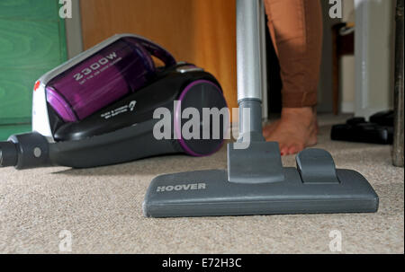 Powerful pull along Hoover vacuum cleaner being used on domestic carpet ...