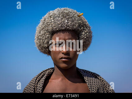 Portrait of a young Afar man with curly hair in Mille, Afar Region ...