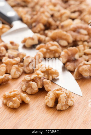 some walnuts on a cutting board Stock Photo - Alamy