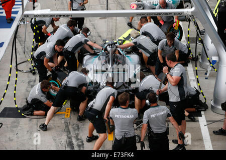 Mercedes AMG Petronas pit crew of driver Nico Rosberg changes tires in ...