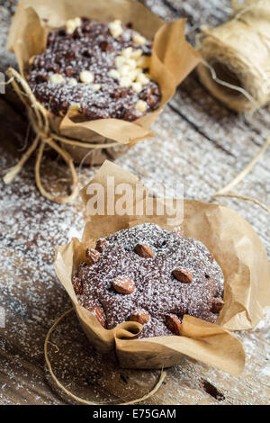 Closeup of decorating chocolate muffins with string Stock Photo - Alamy