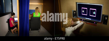 A baby studying with the parents Stock Photo - Alamy