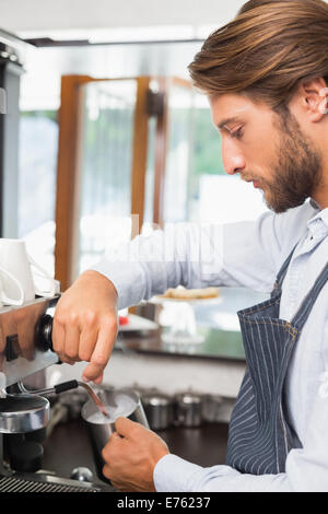 Business man holding a steaming cup of hot coffee on blue modern ...