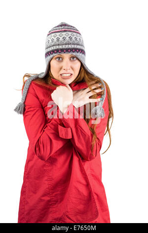 Redhead young woman wearing wool cap clueless and confused expression ...
