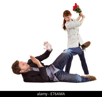 Woman throwing roses at man Stock Photo - Alamy