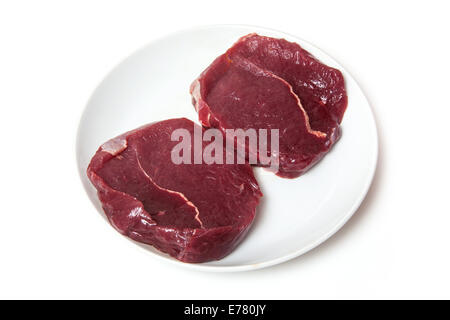 Plate of raw Zebra steaks isolated on a white studio background Stock ...