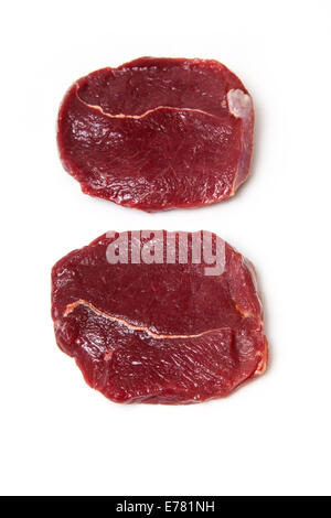 Raw Zebra steaks isolated on a white studio background Stock Photo - Alamy