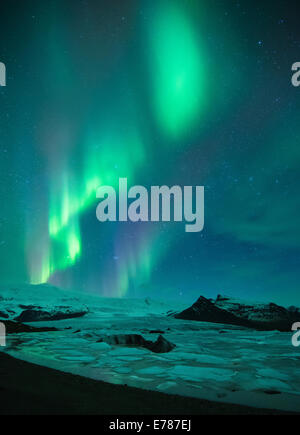 The northern lights (Aurora Borealis) over Indre Karvik, Tromso by a ...