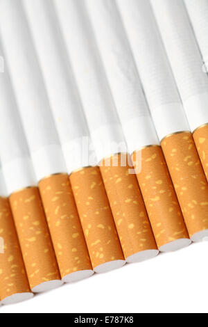 Closeup of filter tipped cigarettes. White background. Shallow depth of ...