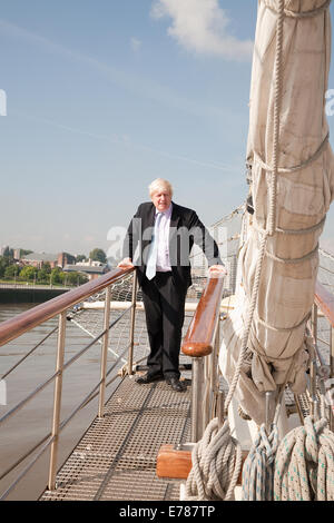 The crew chief on board a Royal Navy Merlin helicopter looks out of the ...