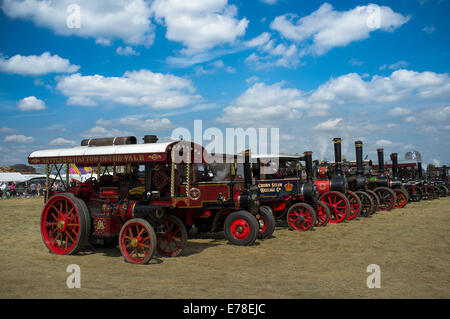 Steam rollers and traction engines in a vintage road works scene, steam ...