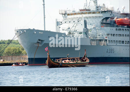 Viking Longboat Next to Royal Navy Huge Ship Stock Photo - Alamy