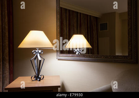 fragment like view of dim lighted interior with desk and chair Stock ...