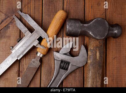 Hammer, caliper, file and wrench Old tools Stock Photo - Alamy