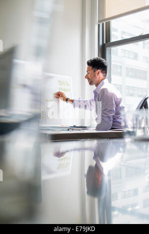 Middle aged man working on computer Stock Photo - Alamy