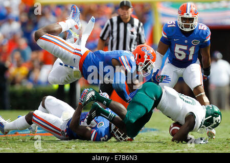 Florida defensive lineman Dante Fowler stretches before drills at the ...